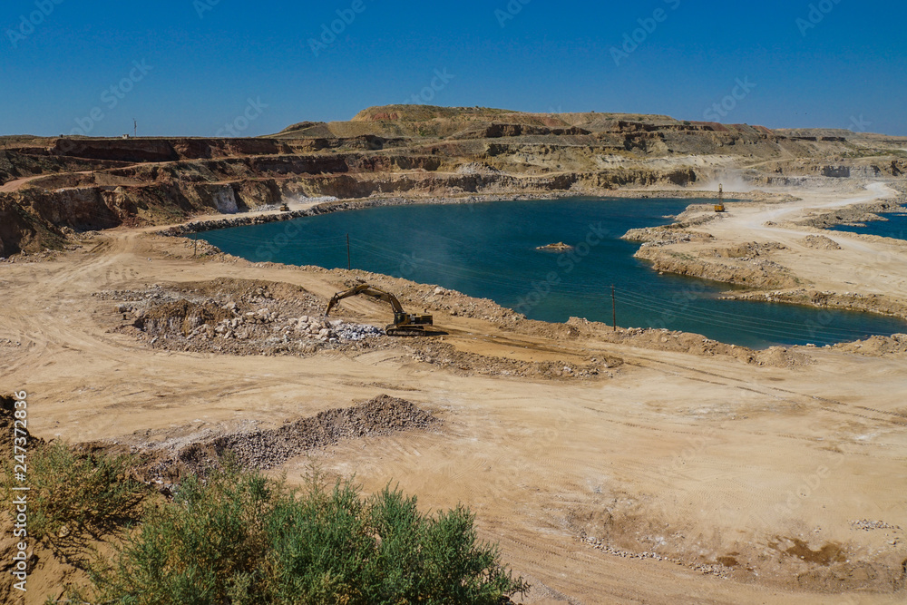Extraction of rock salt at Lake Baskunchak open method. Excavators ...
