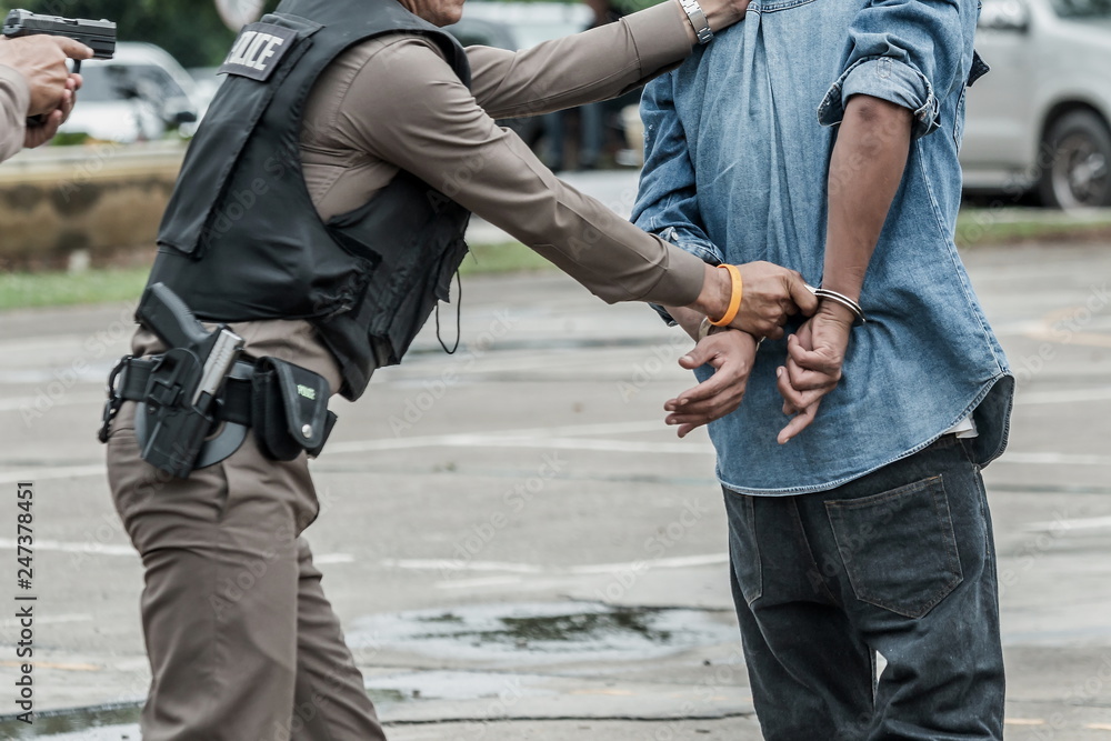 Police arrested,Police,Gun. Stock Photo | Adobe Stock
