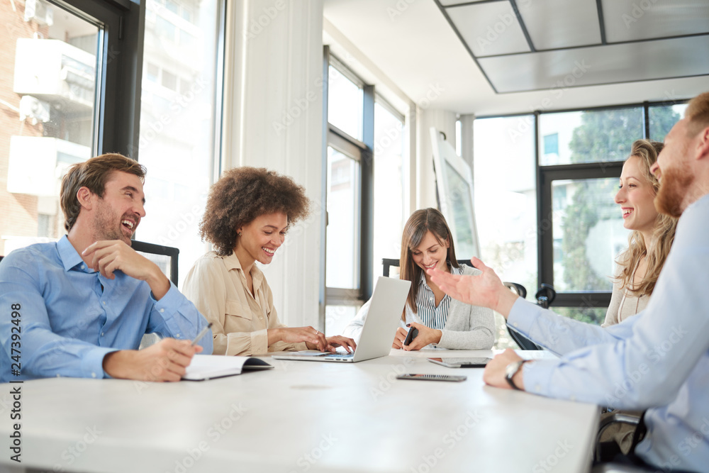 Small group of business people having brainstorming at office. Multi ...