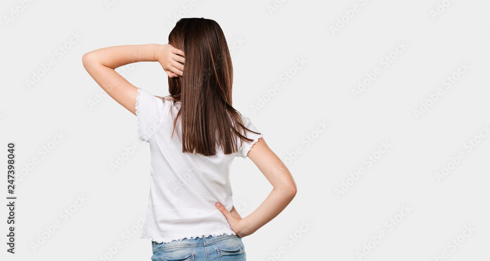 Full body little girl showing back, posing and waiting, looking back ...