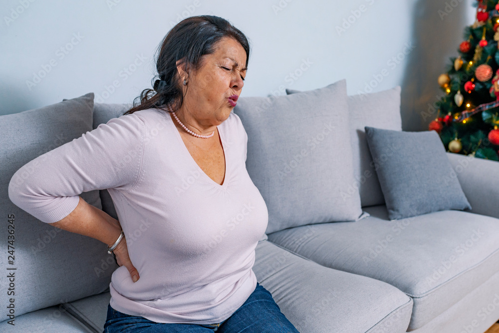 Senior woman suffering from backache at home. Lower Back Pain In ...