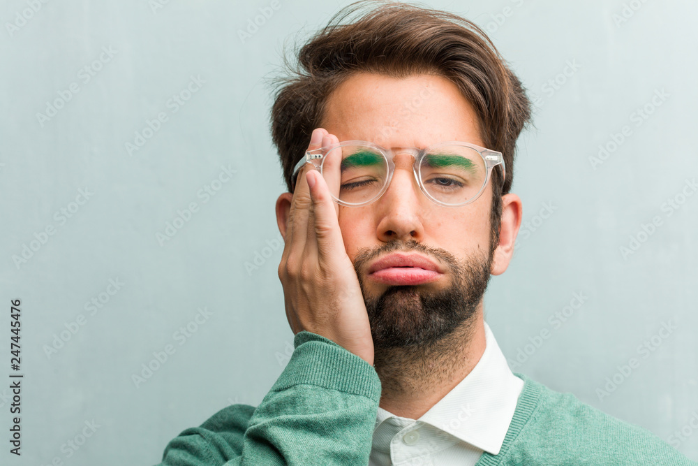 Young handsome entrepreneur man face closeup worried and overwhelmed ...