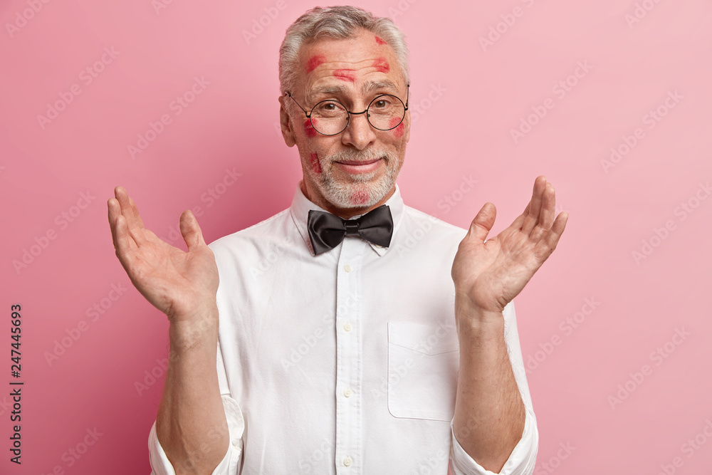 Photo Of Handsome Grey Haired Bearded Man With Red Lipstick Traces On
