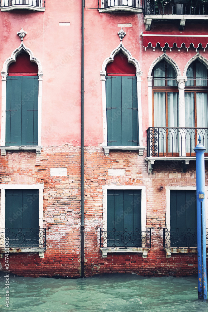 Beautiful old house with Venetian windows, red facade and green ...
