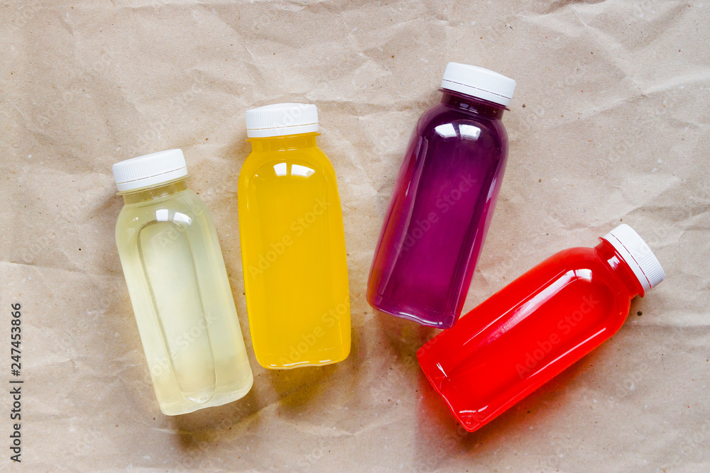 Plastic bottles with lemonade without label on a paper background Stock ...