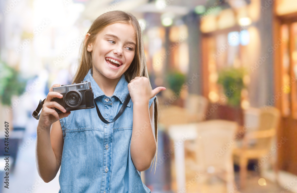 Young beautiful girl taking photos using vintage camera over isolated ...