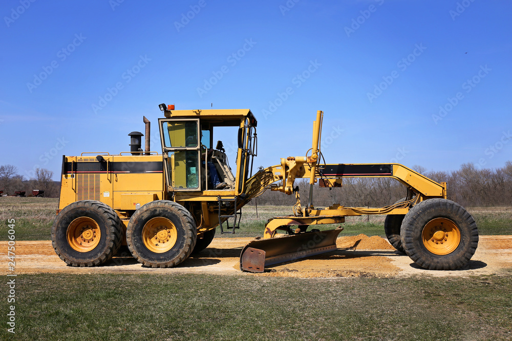 Big Road Grader Construction Truck Working on Rural Gravel Driveway ...