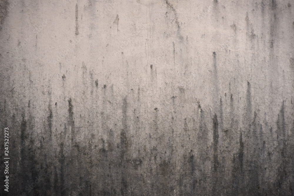 old dirty background with dripping stain on the wall, detail of texture ...