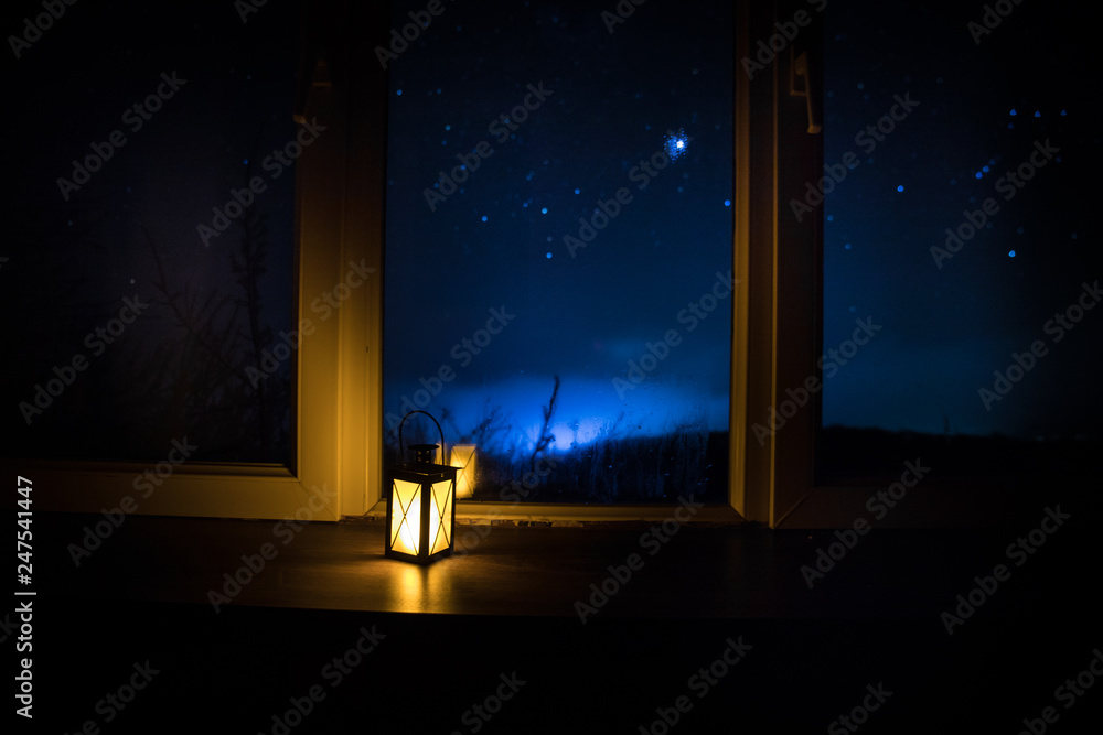 Night scene of stars seen through the window from dark room. Night sky ...