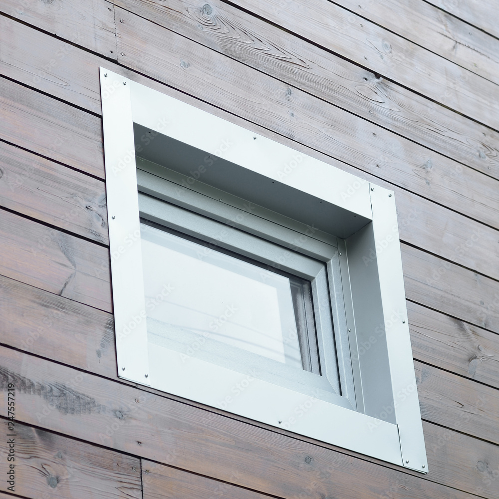 Plastic PVC window in new modern passive wooden house facade wall Stock ...