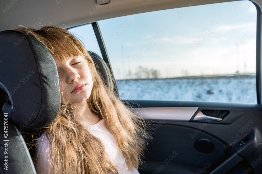 Little girl sitting in car seat and sleeping during long journey Stock ...