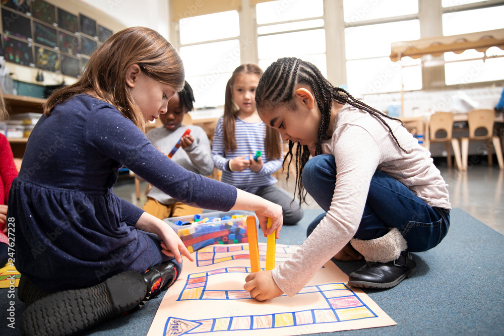 Students playing math game with plastic blocks Stock Photo | Adobe Stock