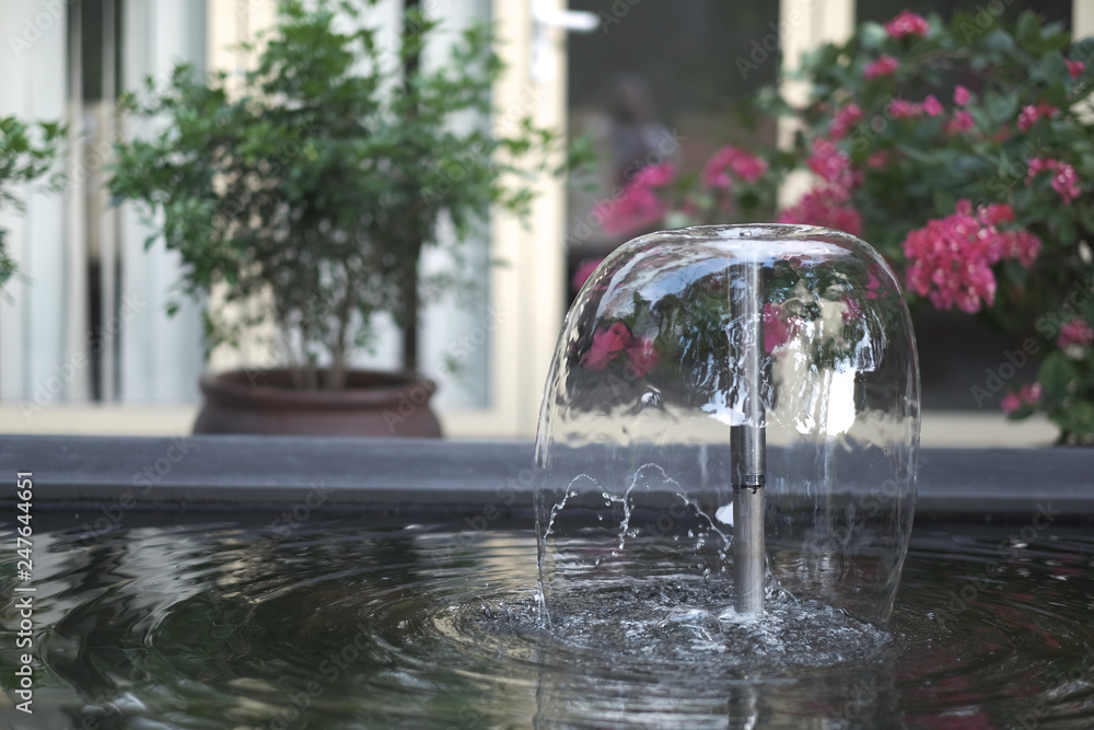 Water bubble fountain in a small pool in the hotel lobby Stock Photo ...