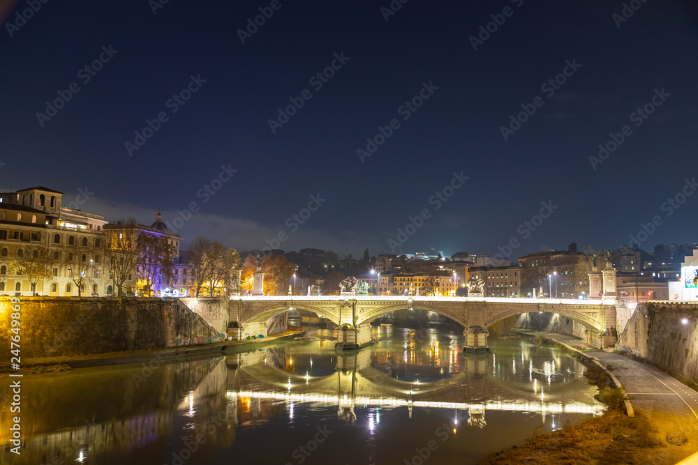 Ponte Vittorio Emanuele II is bridge across Tiber night view. Connects ...