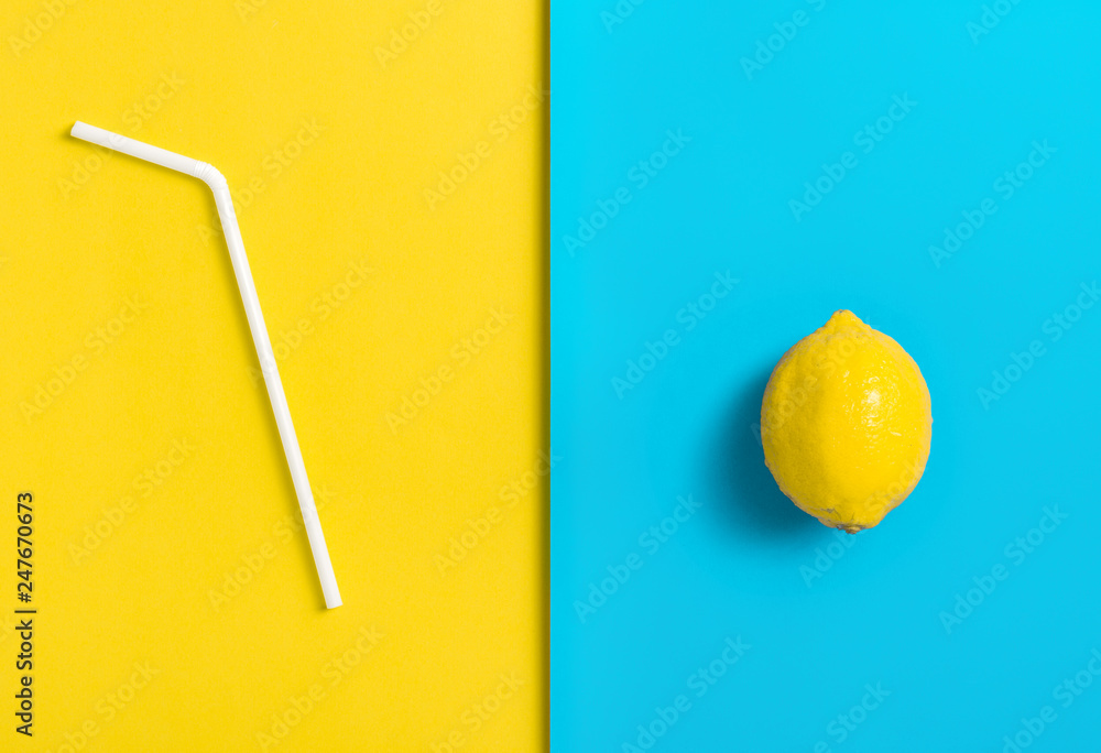 Lemon and straw on split color background. Stock Photo | Adobe Stock