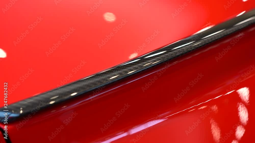 Red sports car motorized slider shot of the trunk with carbon fibre ...