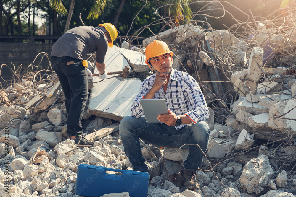 Engineer architect and worker operation control demolish old building ...