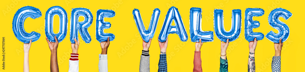 Hands holding core values word in balloon letters Stock Photo | Adobe Stock