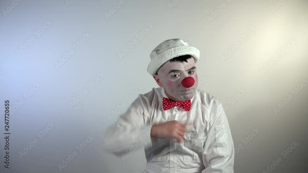 Emoji Clown. A clown is offended and shouts by helping with a megaphone ...