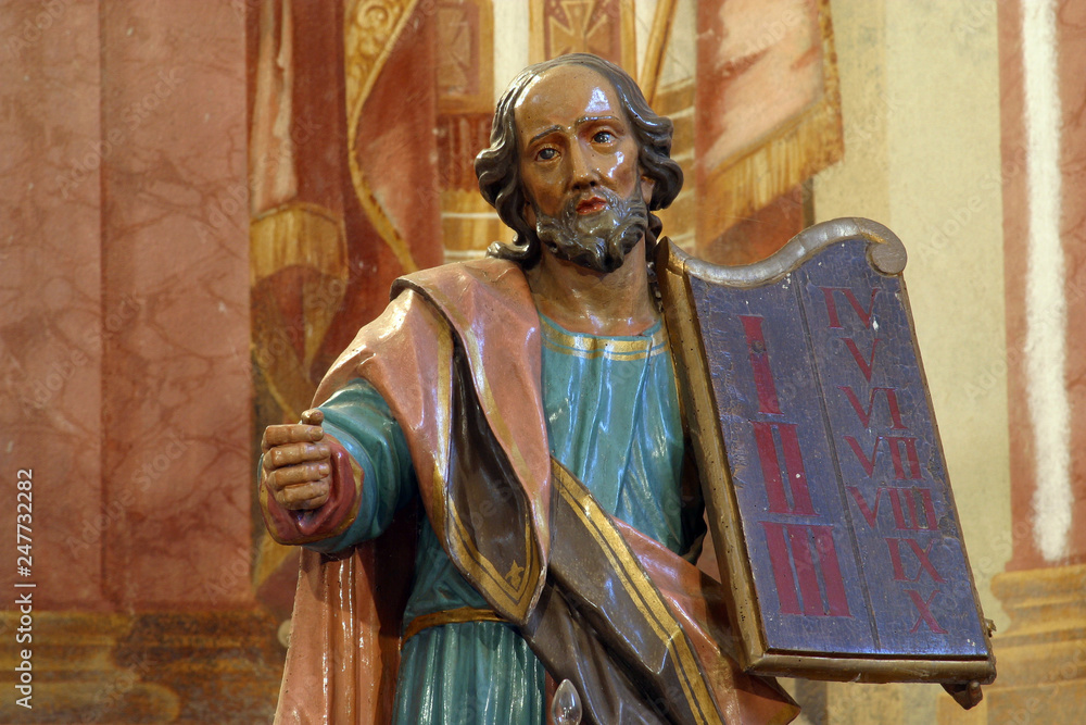 Moses holding the Ten Commandments Stock Photo | Adobe Stock