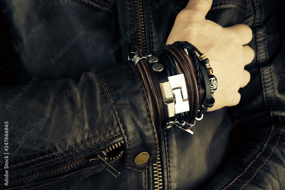 Hand of rocker in leather bracelet and accessory .Hard rock, heavy ...