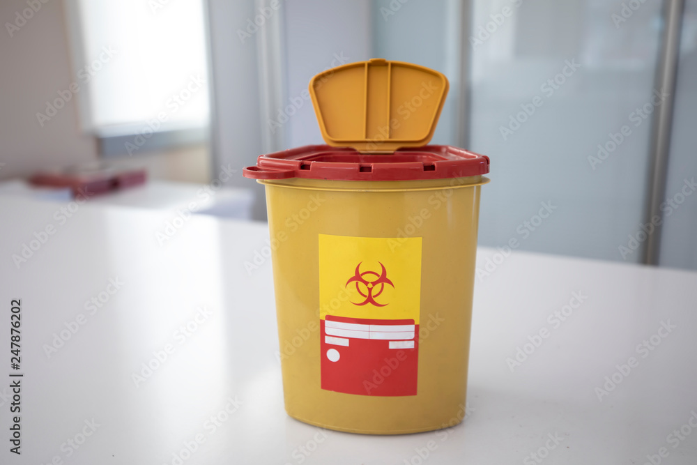 Yellow biohazard medical contaminated sharps clinical waste container ...