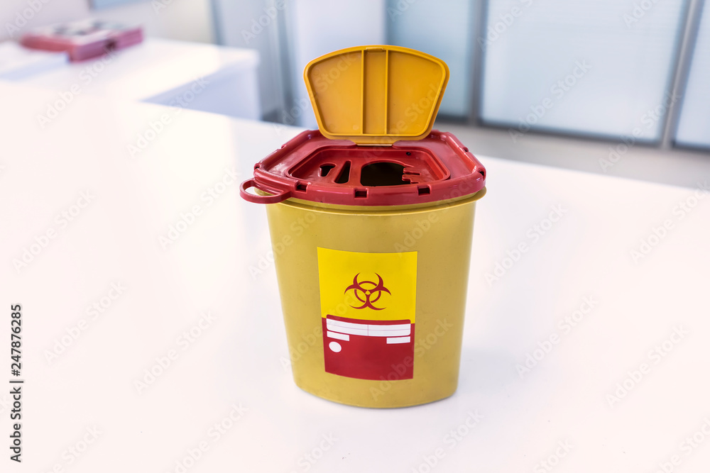 Yellow biohazard medical contaminated sharps clinical waste container ...