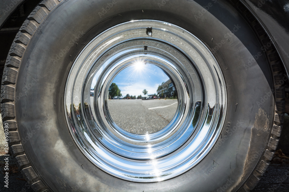 Black tire and chrome mirror cover on the wheel of vintage car Stock ...