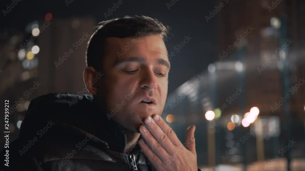 Man calling and talking on smart phone with mimic emotions smiling and ...