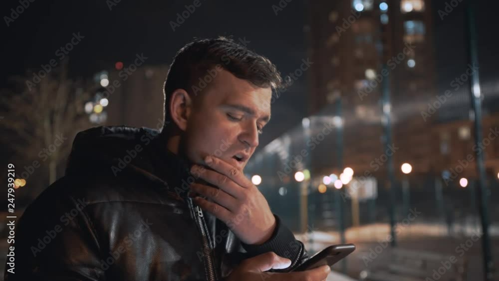 Man calling and talking on smart phone with mimic emotions smiling and ...