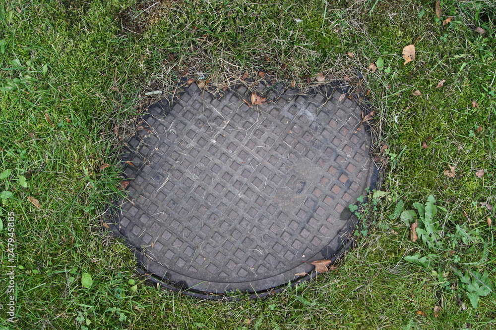 Scandinavian manhole in its urban surrounding. Hidden beauty in design ...