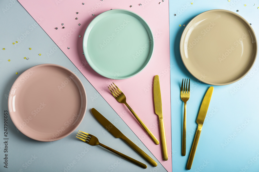 Simple table setting on color background Stock Photo | Adobe Stock