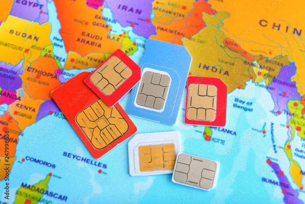 Many sim cards on world map Stock Photo | Adobe Stock