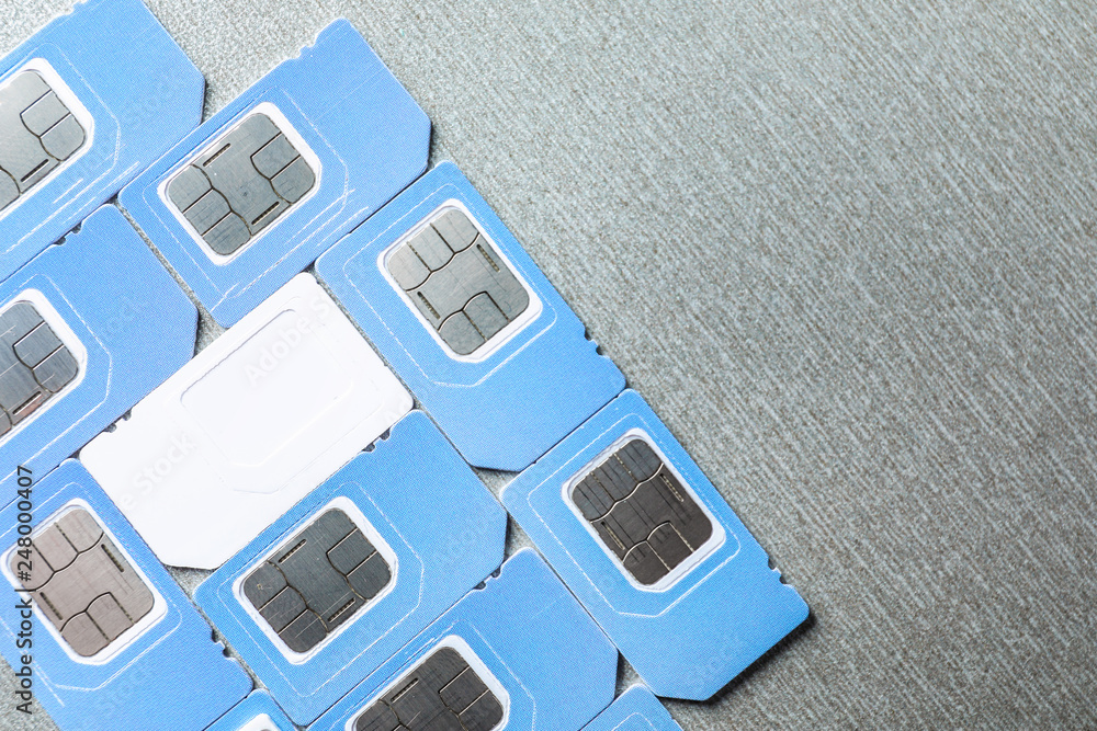 Many sim cards on grey background Stock Photo | Adobe Stock