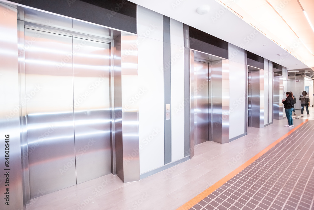 Modern steel elevator cabins in a business lobby or Hotel, Store ...