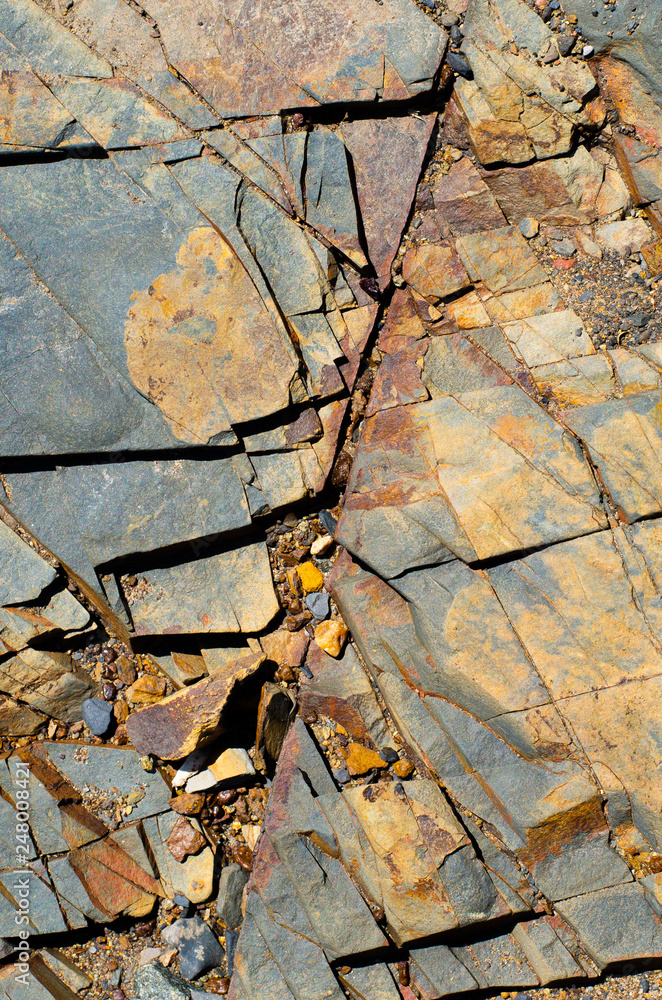 Cracks and fissures in an exposed shale outcrop create beautiful and ...