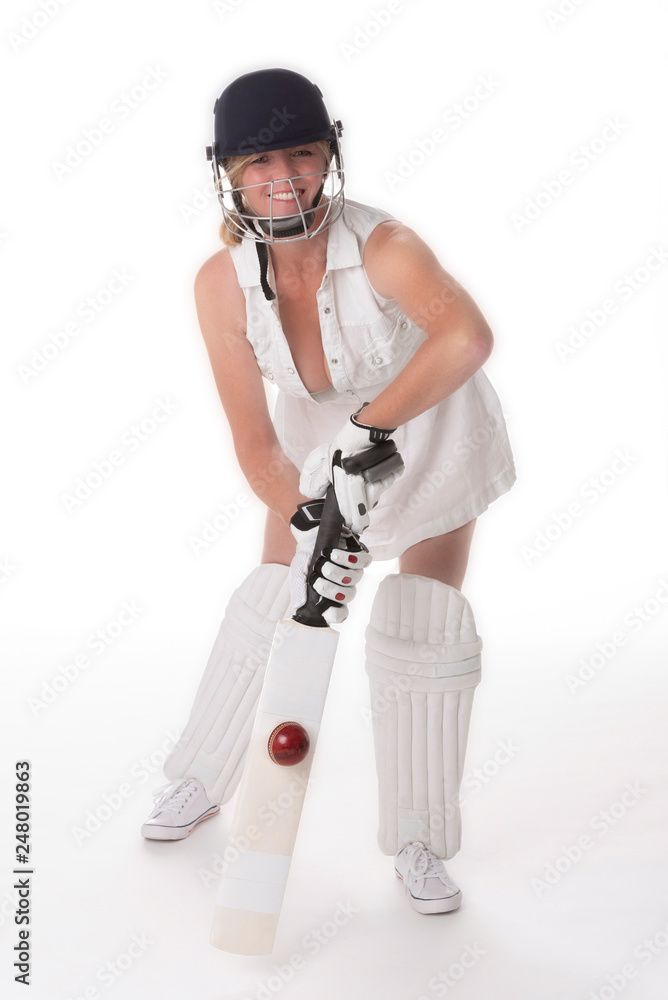 Foto de Woman cricketer in a white revealing dress with a safety helmet ...