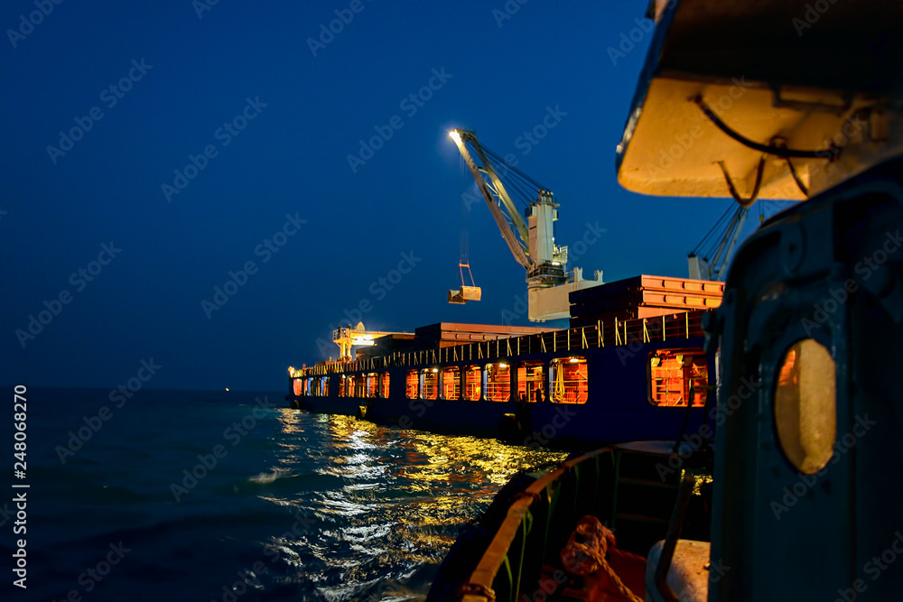 Night loading big mother sea bulk carrier ship with Bauxite aluminium ...