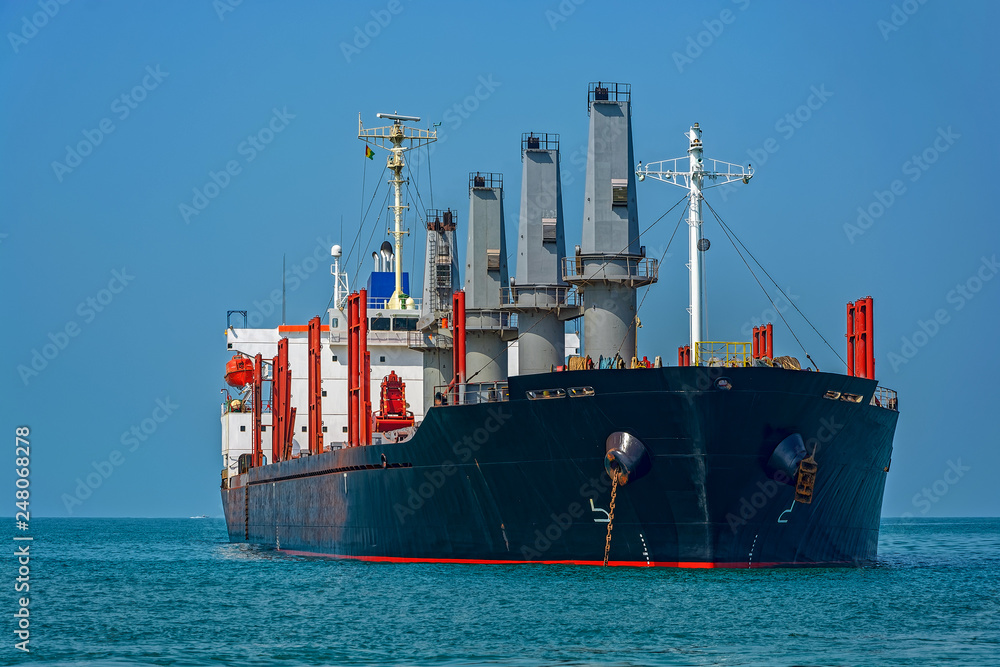 Bulk ore carrier vessel is awaiting loading of bauxite ore at outer ...