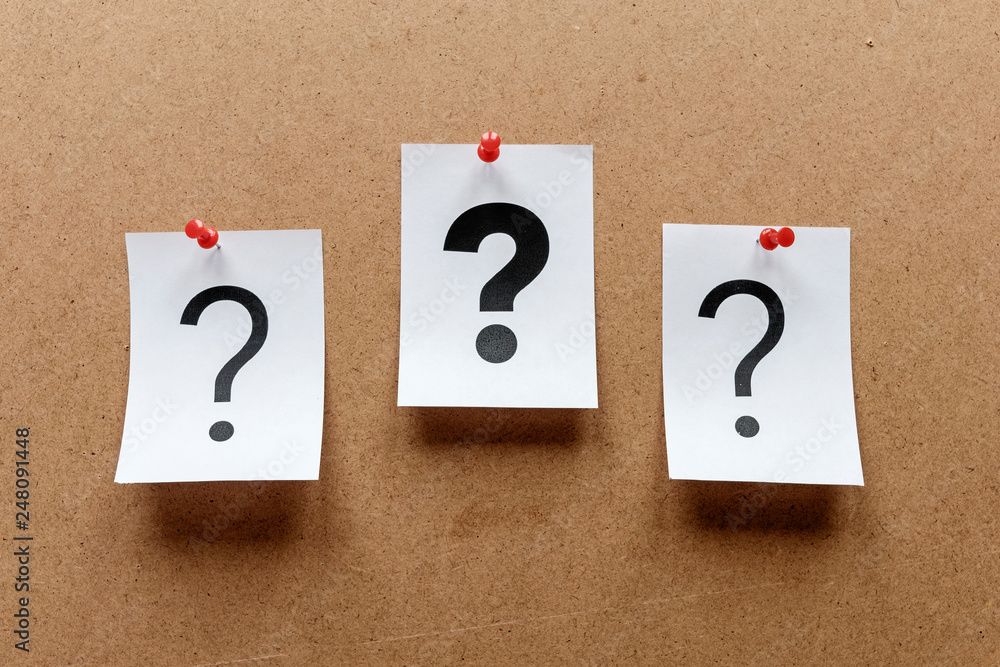 Three question marks pinned to a notice board Stock Photo | Adobe Stock