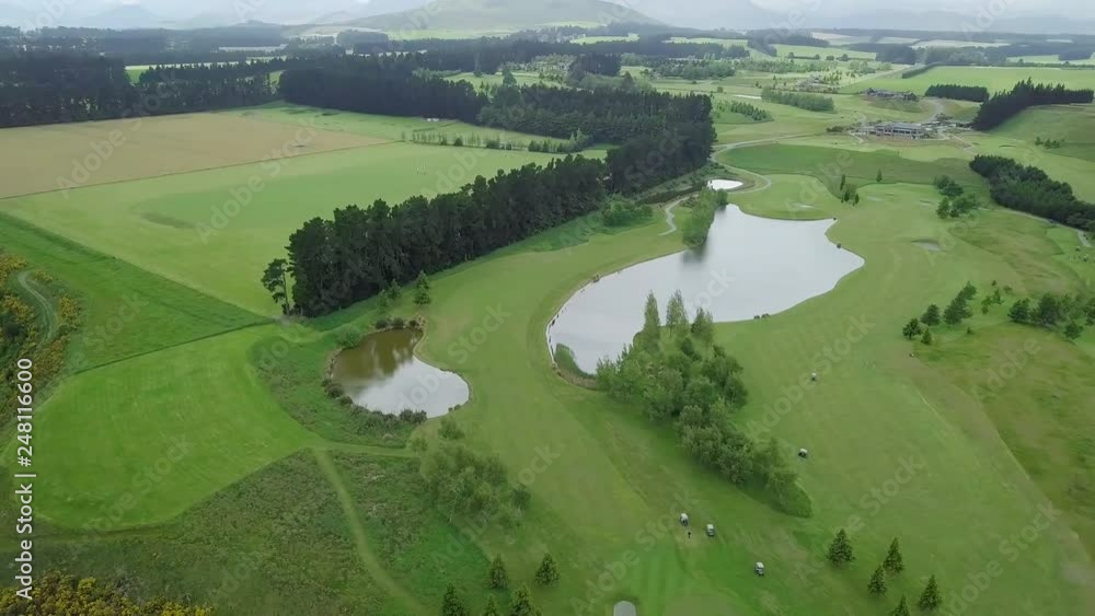 Aerial shot of large golf course with green lawn Stock Video | Adobe Stock