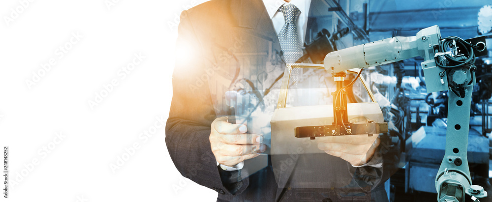 Man hand holding tablet or cell-phoner with automate wireless Robot arm ...