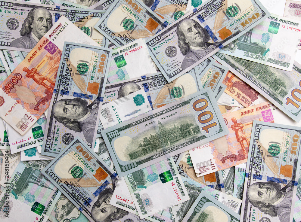 Dollars and Russian rubles on the table as background Stock Photo ...