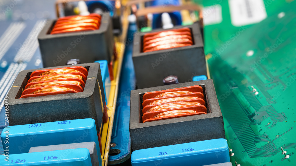 Close-up of copper coils and circuit boards for laptop mainboards ...