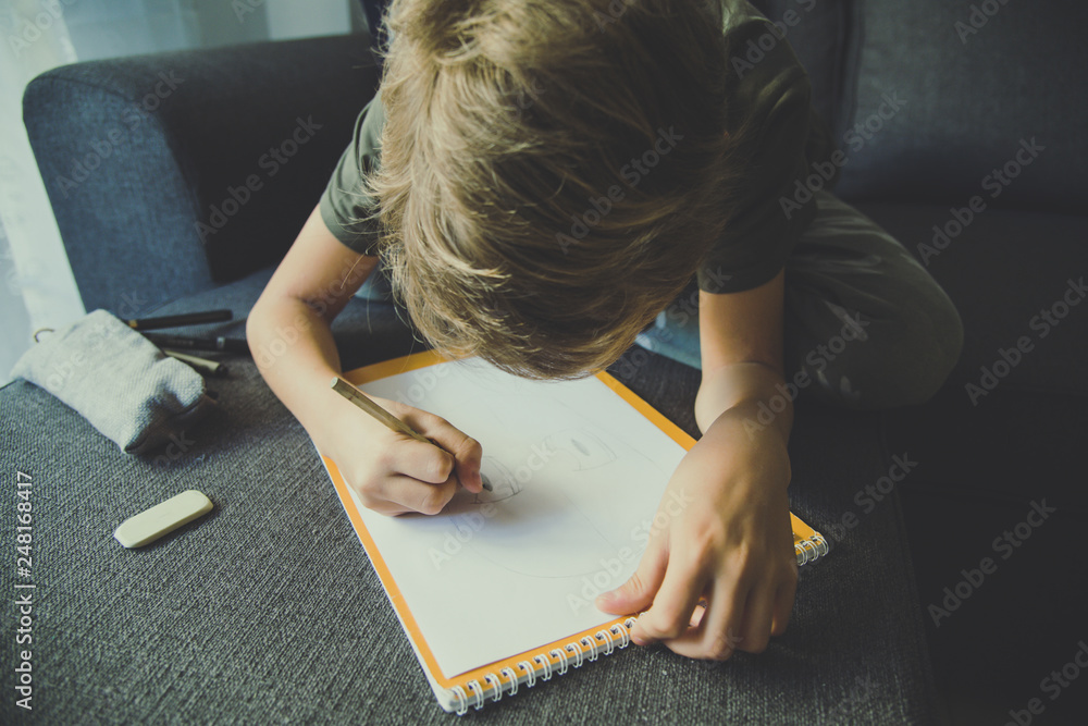 Teenager Drawing Something