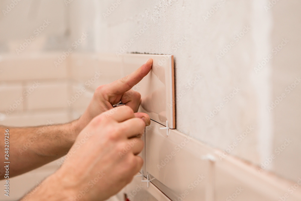 Stylish trendy beige ceramic tiles with chamfer on the kitchen wall ...