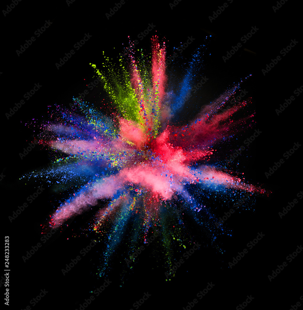 Multi colored powder explosion isolated on black Stock Photo | Adobe Stock