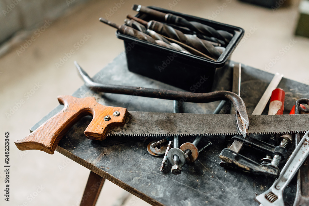 old work tool is on the table , small workroom with architecture dummy ...
