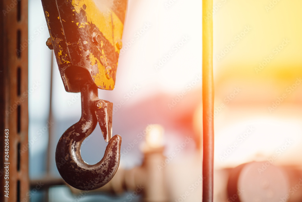 Crane chain and hook with blurred warehouse background. Concept ...