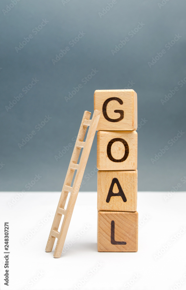 tower of cubes with an inscription goal and a up ladder. The concept of ...